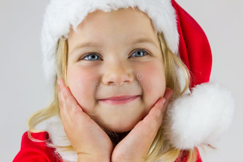 Portrait of a Happy Girl in a Red New Year Cap Stock Photo - Image of ...