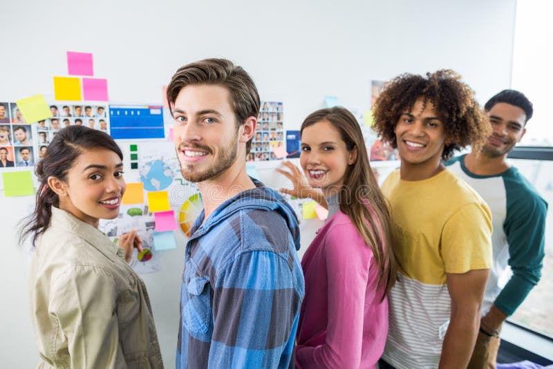 Portrait of Happy Graphic Designers Reading Documents Stock Image ...