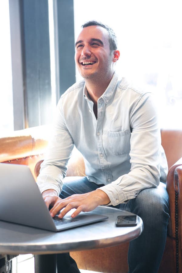 Happy Guy Sitting at Cafe Using Laptop Computer Stock Image - Image of ...