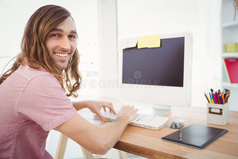 Portrait of Happy Hipster Typing on Keyboard in Office Stock Image ...