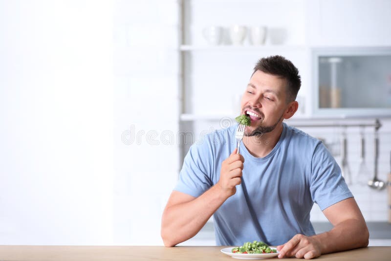 Portrait of Happy Man Eating Broccoli Salad Stock Photo - Image of ...