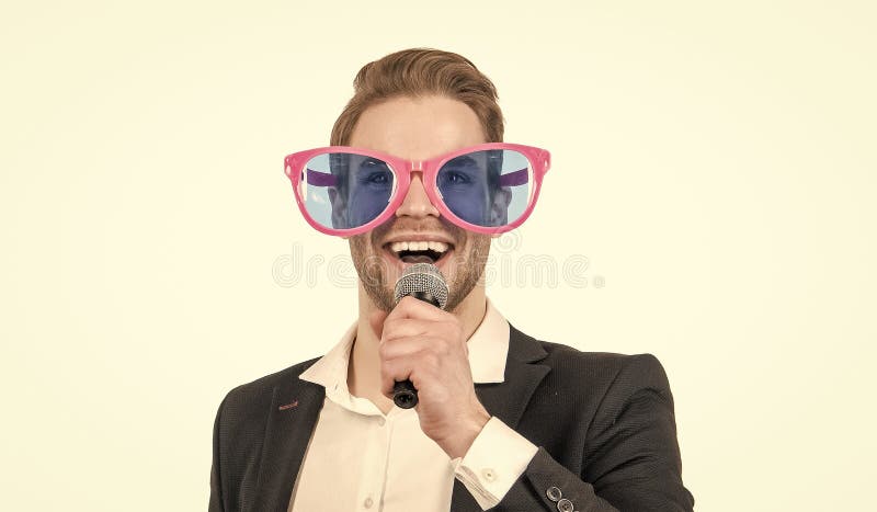 Portrait Of Happy Man In Formalwear And Funny Glasses Sing Song To Microphone Singing Stock