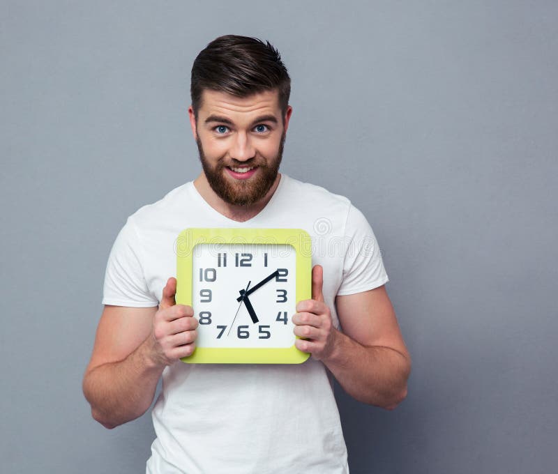 Man Holding Wall Clock Stock Images - Download 572 Royalty Free Photos