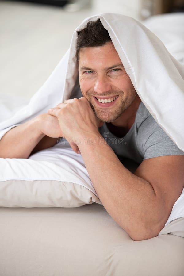 Portrait Happy Man Lying Under Blanket Stock Photo - Image of pleased ... Portrait Happy Man Lying Under Blanket Stock Photo - Image of pleased ...