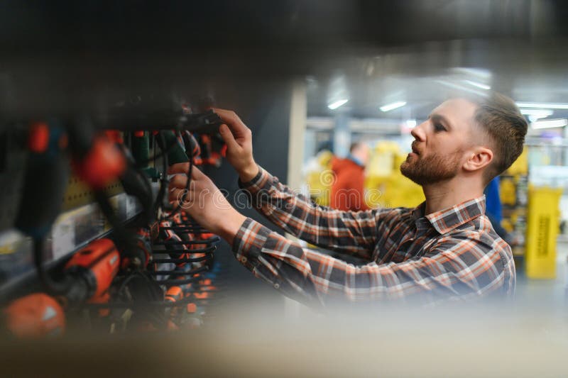 Portrait of Happy Mature Man Standing in Hardware Store Stock Photo ...