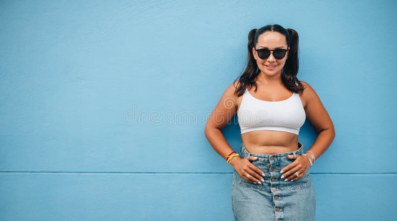 Portrait of Happy Model Plus Size in Sunglasses at Blue Wall Stock ...