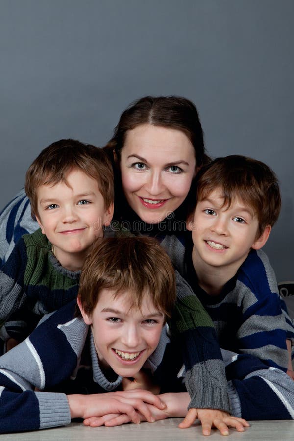 Portrait of Happy Mother and Three Sons, Studio Stock Image - Image of ...