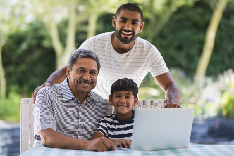 Portrait of Happy Multi-generation Family Using Laptop at Porch Stock ...