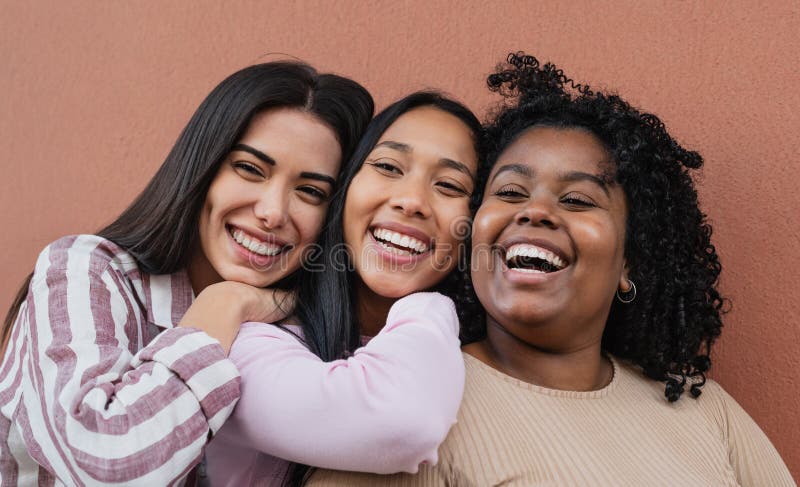 Portrait of Happy Multiracial Friends Embracing and Smiling in Front ...