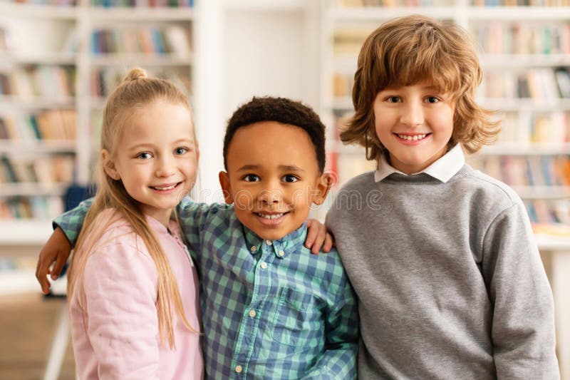 Portrait of Happy Multiracial Primary School Classmates Embracing and ...