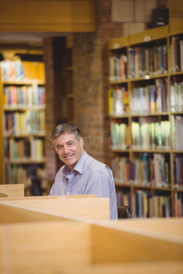 Professor Sitting at Desk Using Digital Tablet Stock Image - Image of ...