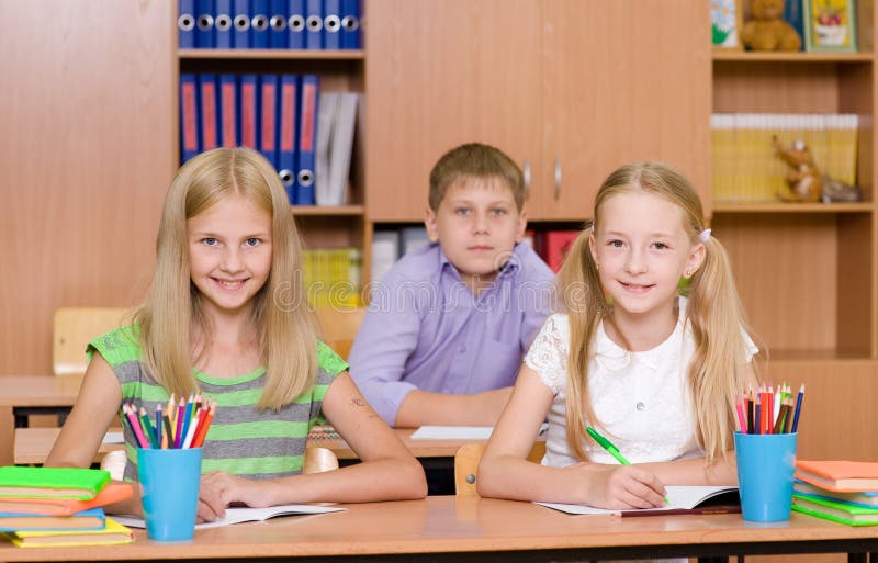 Portrait of Happy Schoolkids in Classroom Stock Photo - Image of ...