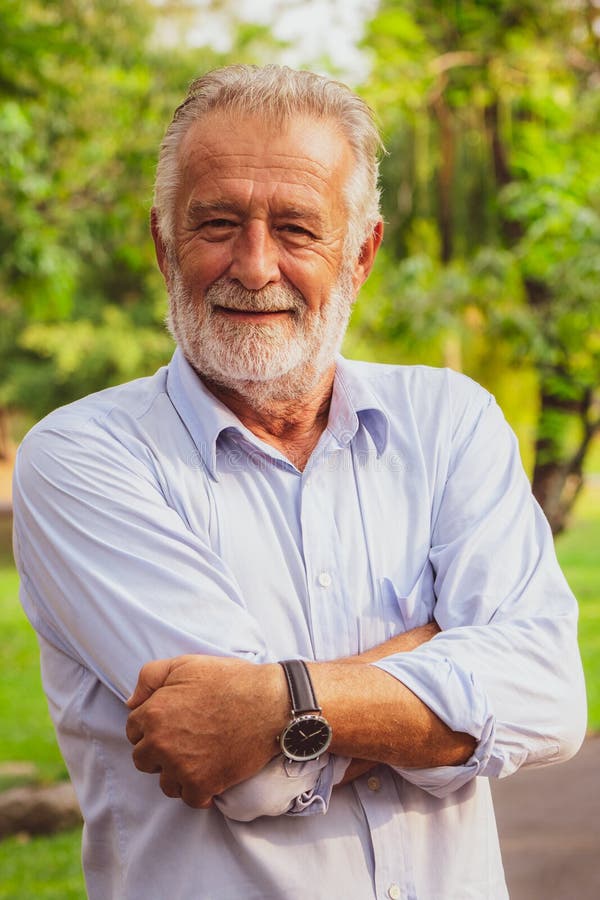 Portrait of Happy Senior Man Standing in the Park. Stock Image - Image ... Portrait of Happy Senior Man Standing in the Park. Stock Image - Image ...