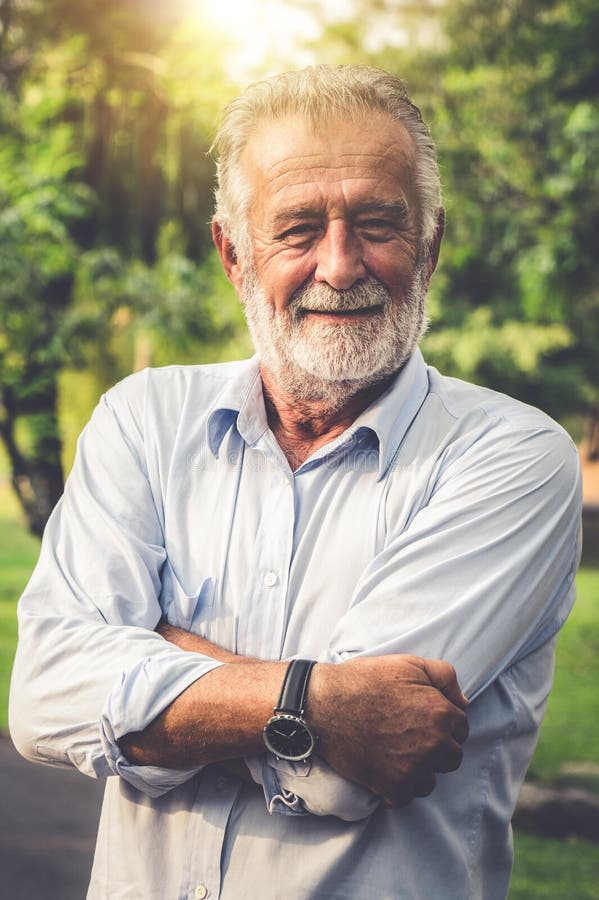 Portrait of Happy Senior Man Standing in the Park. Stock Image - Image ... Portrait of Happy Senior Man Standing in the Park. Stock Image - Image ...