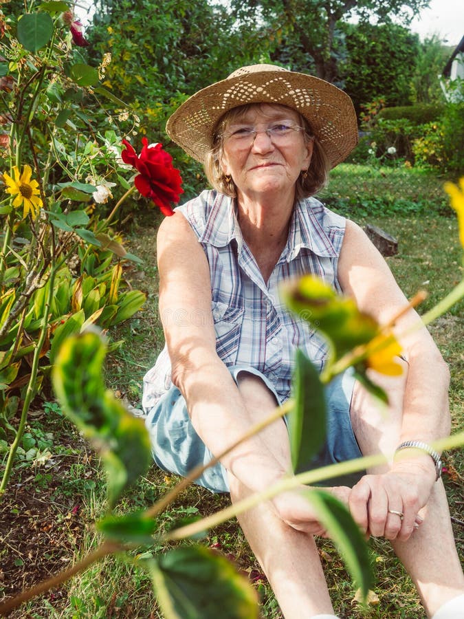 Portrait of a Happy Senior Woman in Her Garden. Stock Photo - Image of ... Portrait of a Happy Senior Woman in Her Garden. Stock Photo - Image of ...