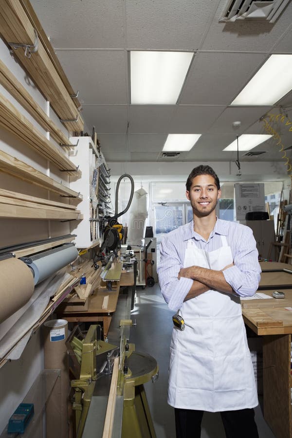 Portrait of a Happy Skilled Worker Standing with Arms Crossed in ...