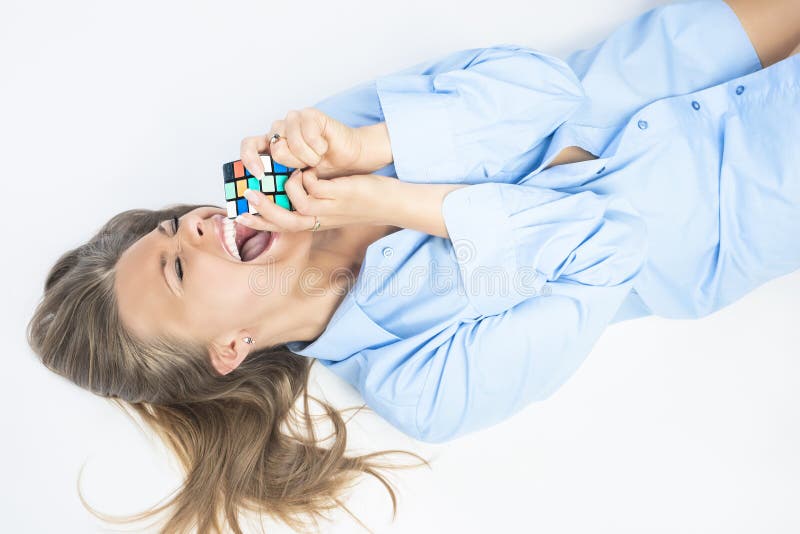 Portrait of Happy Smiling Blond Female Playing with Rubik S Cube ...