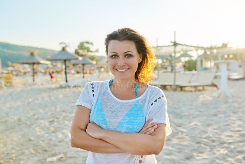 Portrait of Happy Smiling Confident Middle Aged Woman on Beach Stock ... Portrait of Happy Smiling Confident Middle Aged Woman on Beach Stock ...