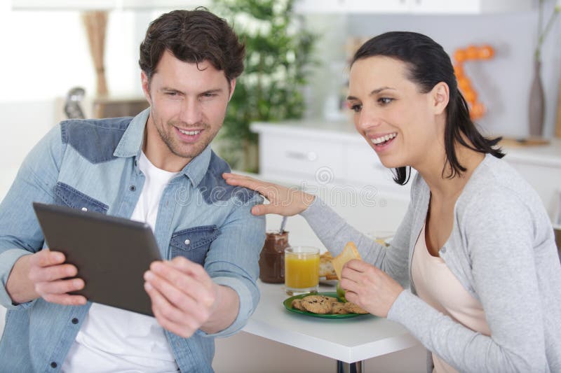 Portrait Happy Smiling Couple Looking at Tablet Stock Image - Image of ...