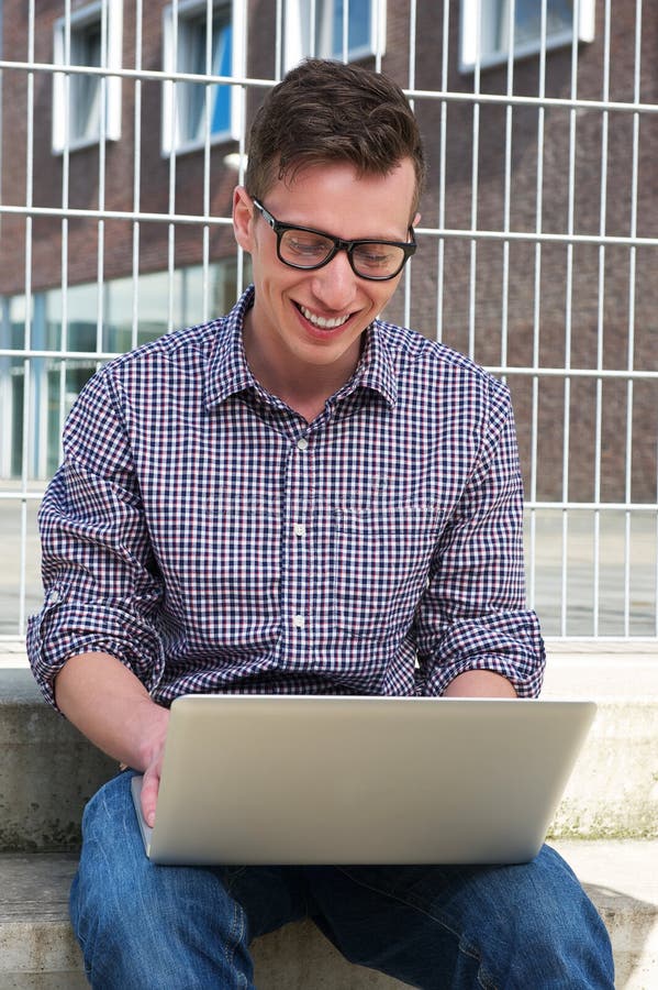 Portrait of a Happy Student Working on Laptop Outdoors Stock Image ...