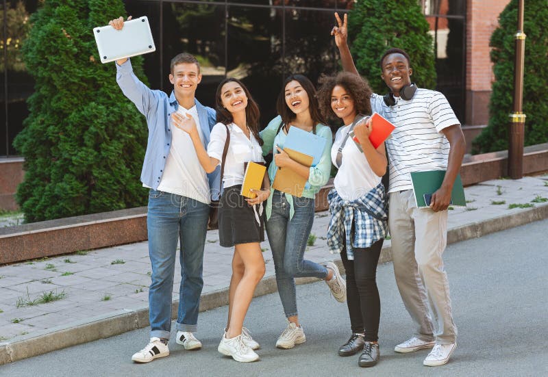 Portrait of Happy University Students Posing Outdoors after Study or ...