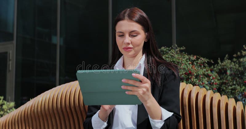 Portrait of a Happy Woman Face Looking Tablet Screen Outdoors. Woman ...