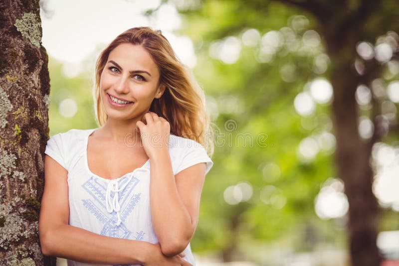 Portrait of Happy Woman Standing by Tree Stock Photo - Image of park ...
