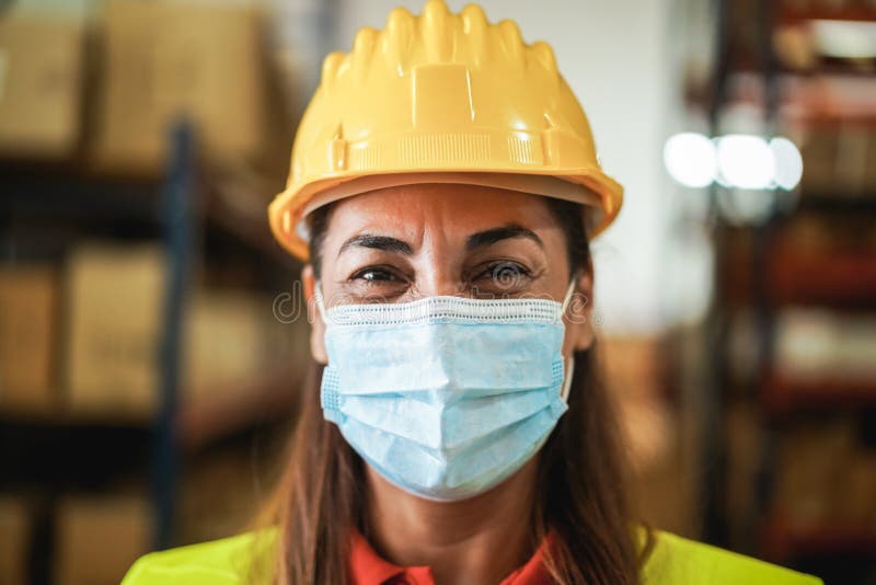 Portrait of Happy Worker Woman Looking at Camera Inside Warehouse while ...