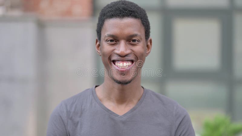 Portrait of Happy Young African Man Smiling at Camera Stock Image ...
