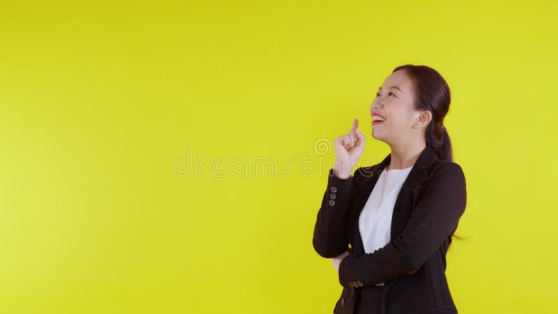 Portrait Happy Young Asian Business Woman Presenting Isolated on Yellow ... Portrait Happy Young Asian Business Woman Presenting Isolated on Yellow ...