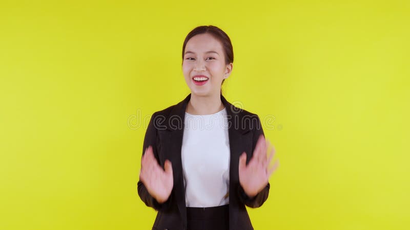 Portrait Happy Young Asian Business Woman Presenting Isolated on Yellow ... Portrait Happy Young Asian Business Woman Presenting Isolated on Yellow ...
