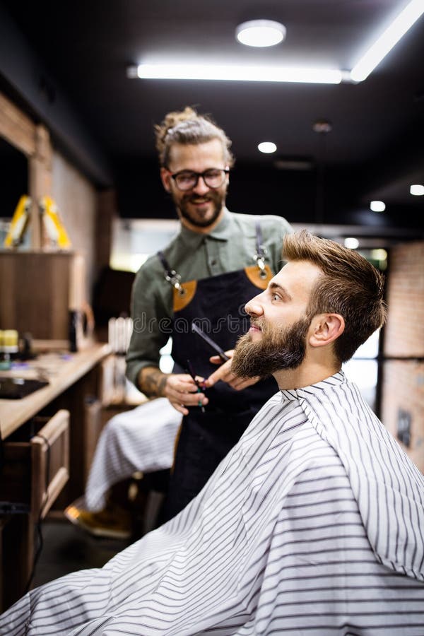 Portrait of Happy Young Barber with Client at Barbershop and Smiling ... Portrait of Happy Young Barber with Client at Barbershop and Smiling ...