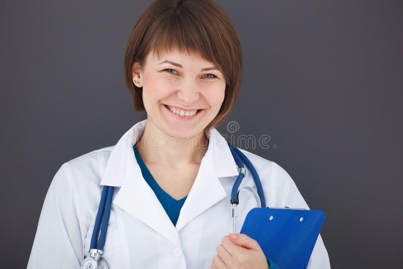 Portrait of Happy Young Doctor on Gray Background Stock Photo - Image ...