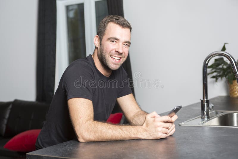 Portrait of Happy Young Man at Home Stock Photo - Image of phone ...