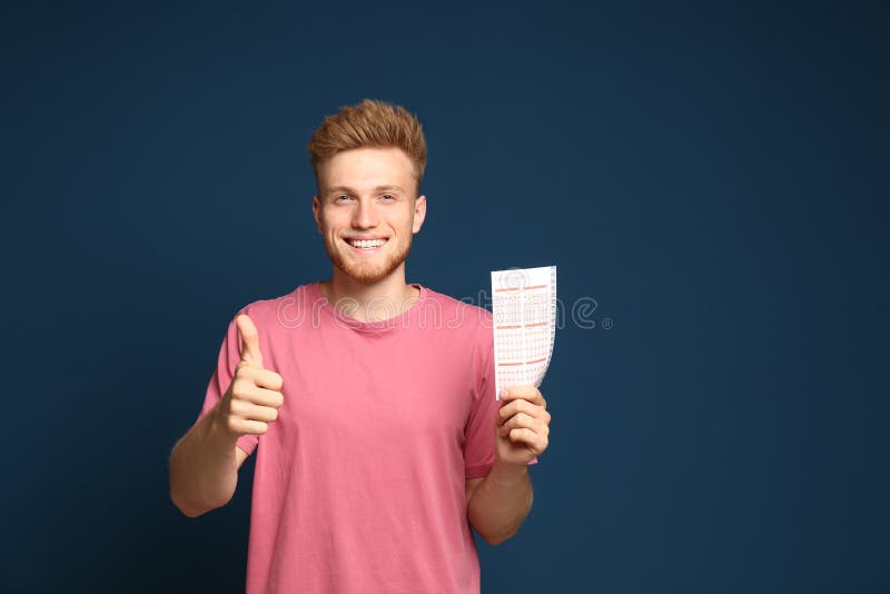 Portrait of Happy Young Man with Lottery Ticket on Background Stock ...
