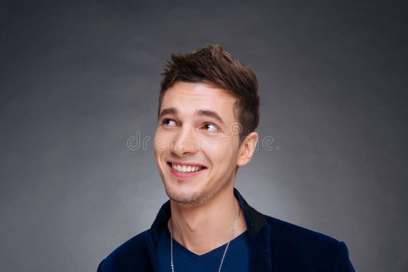 Portrait of a Happy Young Man Smiling on Gray Background Stock Image ...
