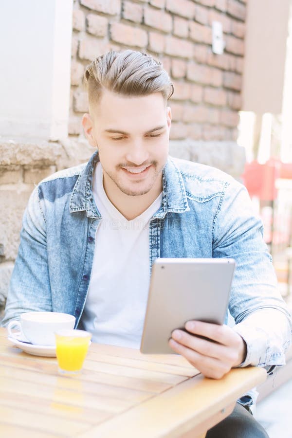 200 Happy Young Man Holding Ipad Stock Photos - Free & Royalty-Free ...