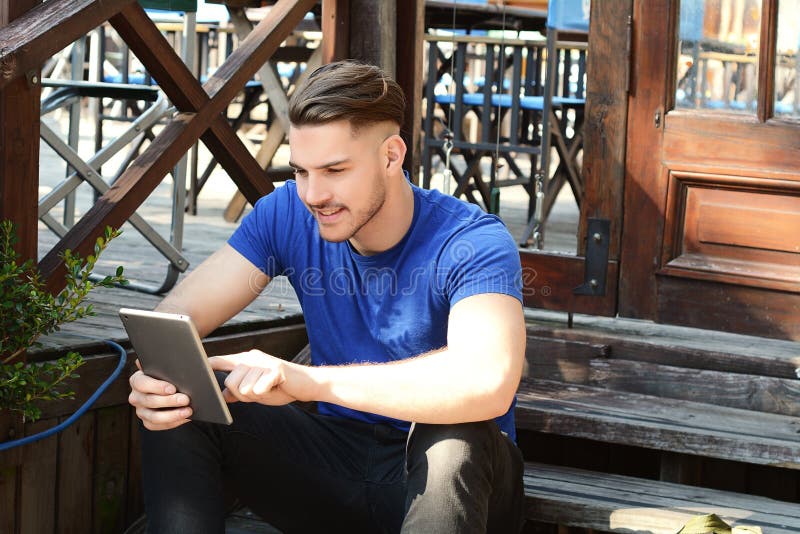 Portrait of Happy Young Man Using Tablet Stock Image - Image of adult ...
