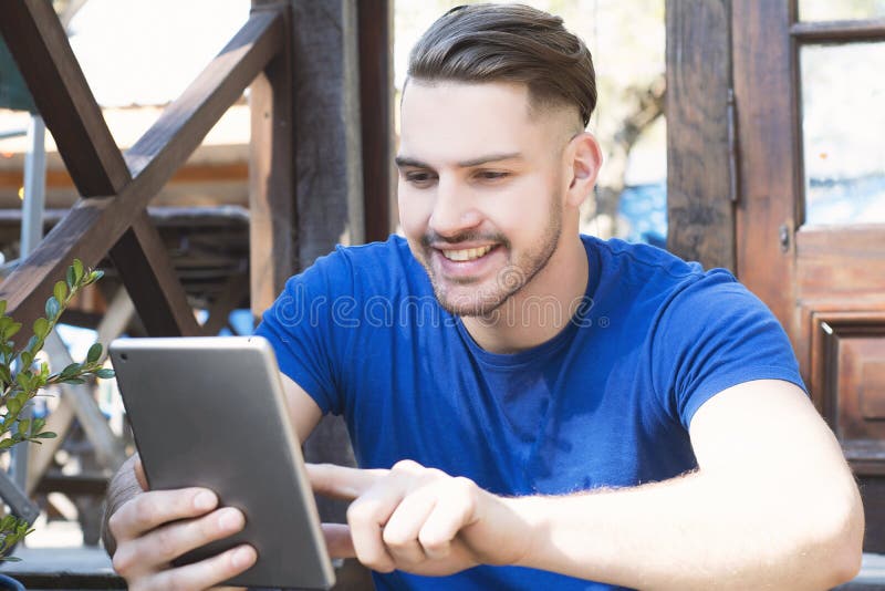 Portrait of Happy Young Man Using Tablet Stock Image - Image of mobile ...