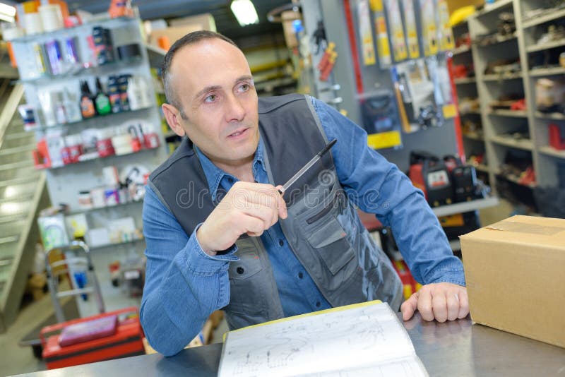 Portrait Hardware Store Worker Stock Image - Image of standing, name ...