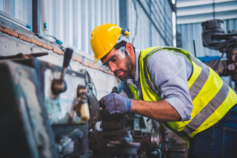 Portrait of Heavy Industry Workers Working on the Metal Fabrication ...
