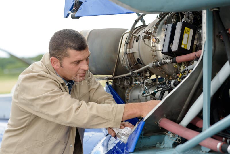 Portrait Helicopter Mechanic at Work Stock Image - Image of aviation ...
