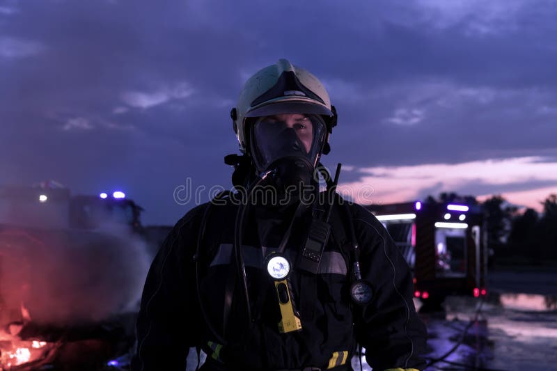 Portrait of a Heroic Fireman in a Protective Suit. Firefighter in Fire ...