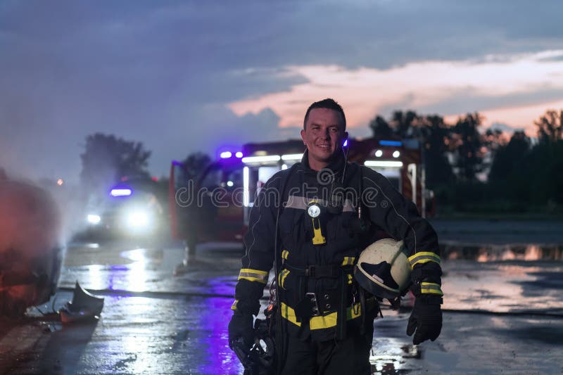 Portrait of a Heroic Fireman in a Protective Suit. Firefighter in Fire ...