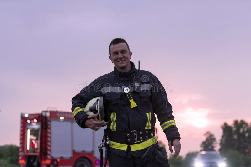 Close-up Portrait of a Heroic Fireman in a Protective Suit. Firefighter ...