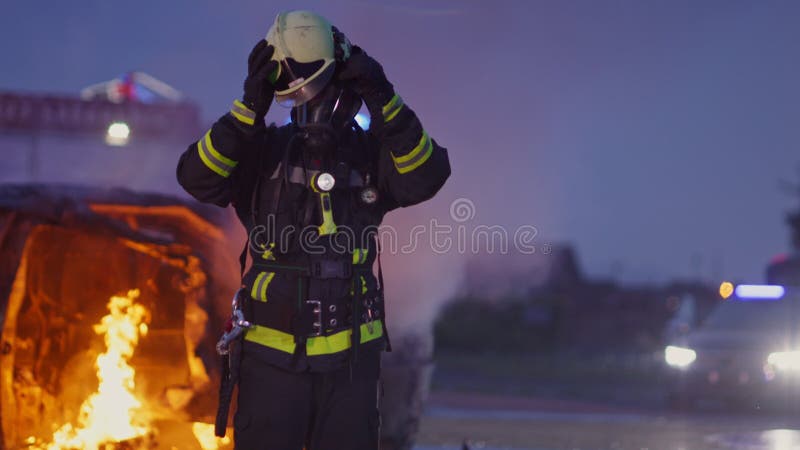 Portrait of a Heroic Fireman in a Protective Suit. Firefighter in Fire ...
