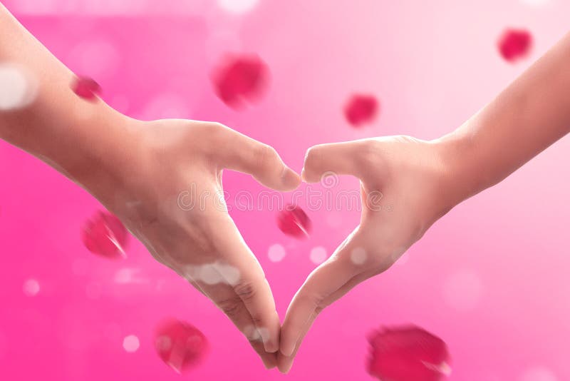 Portrait of Human Hands Making the Shape of a Heart with a Pink ...