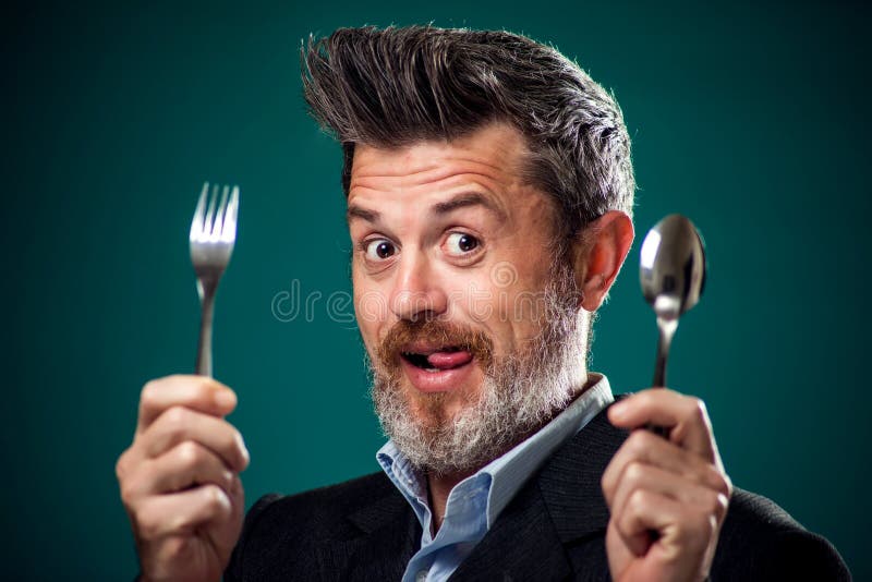 A Portrait of Hungry Man in Suit Holding Spoon and Fork Stock Image ...