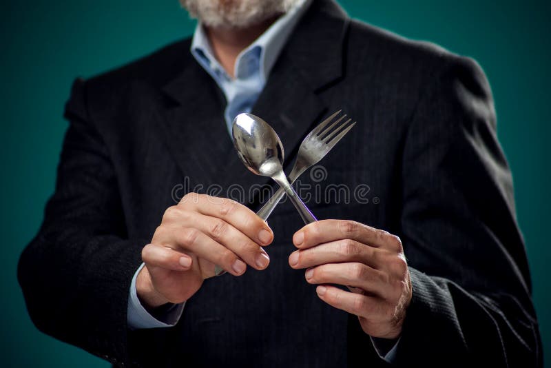 A Portrait of Hungry Man in Suit Holding Spoon and Fork Stock Photo ...