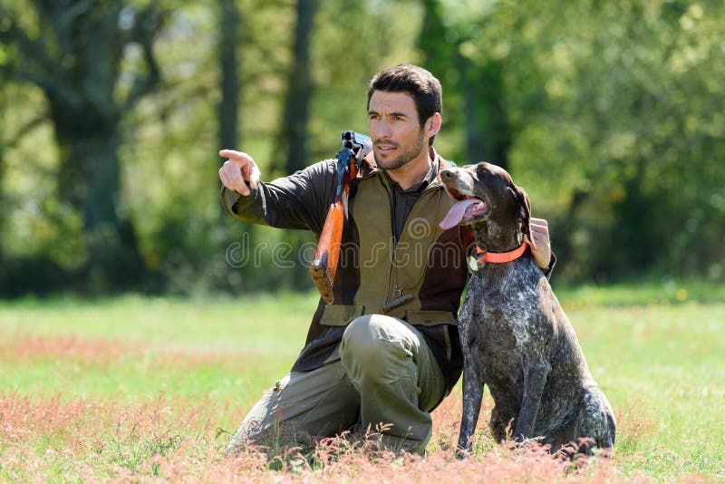 Portrait hunter with dog stock image. Image of output - 160602937